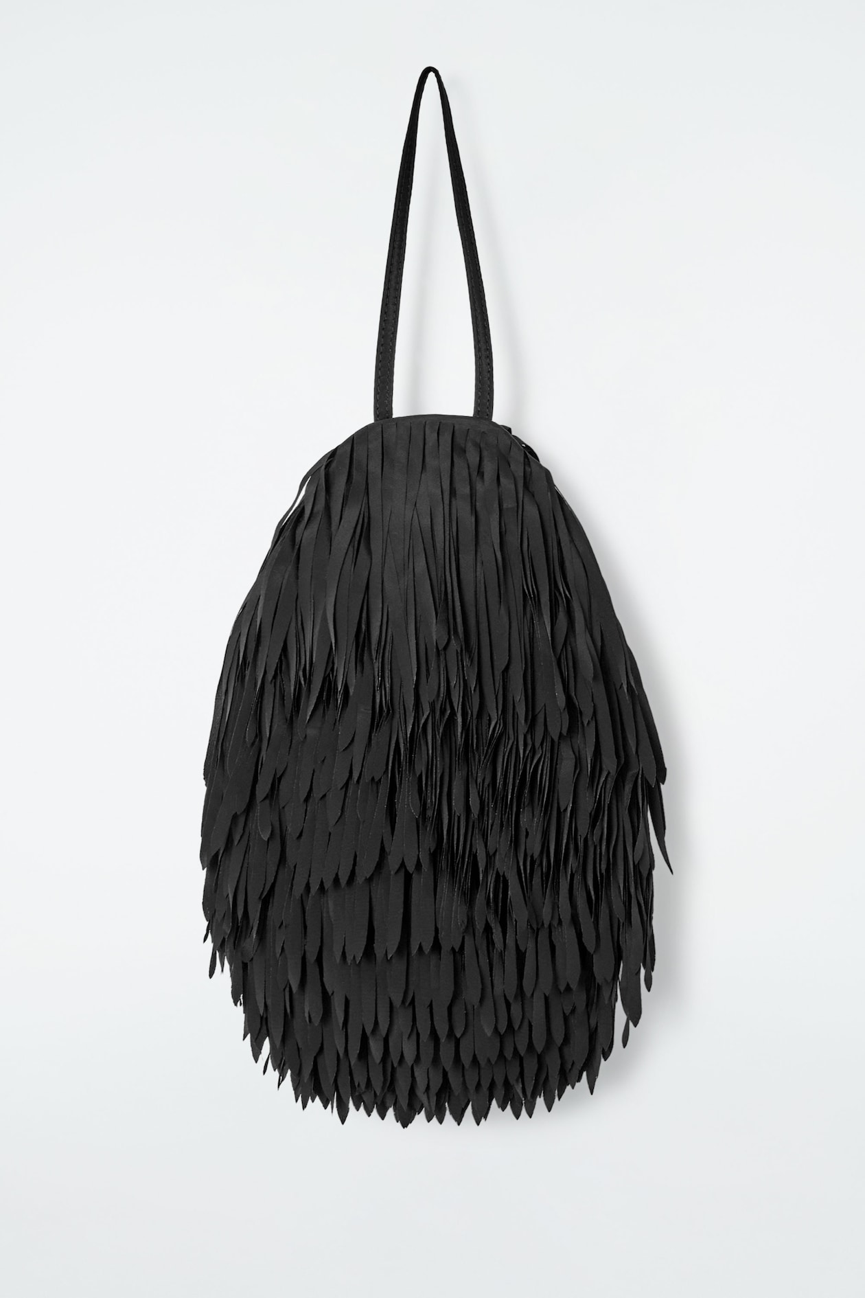 FRINGED CLUTCH BAG - BLACK | COS DE