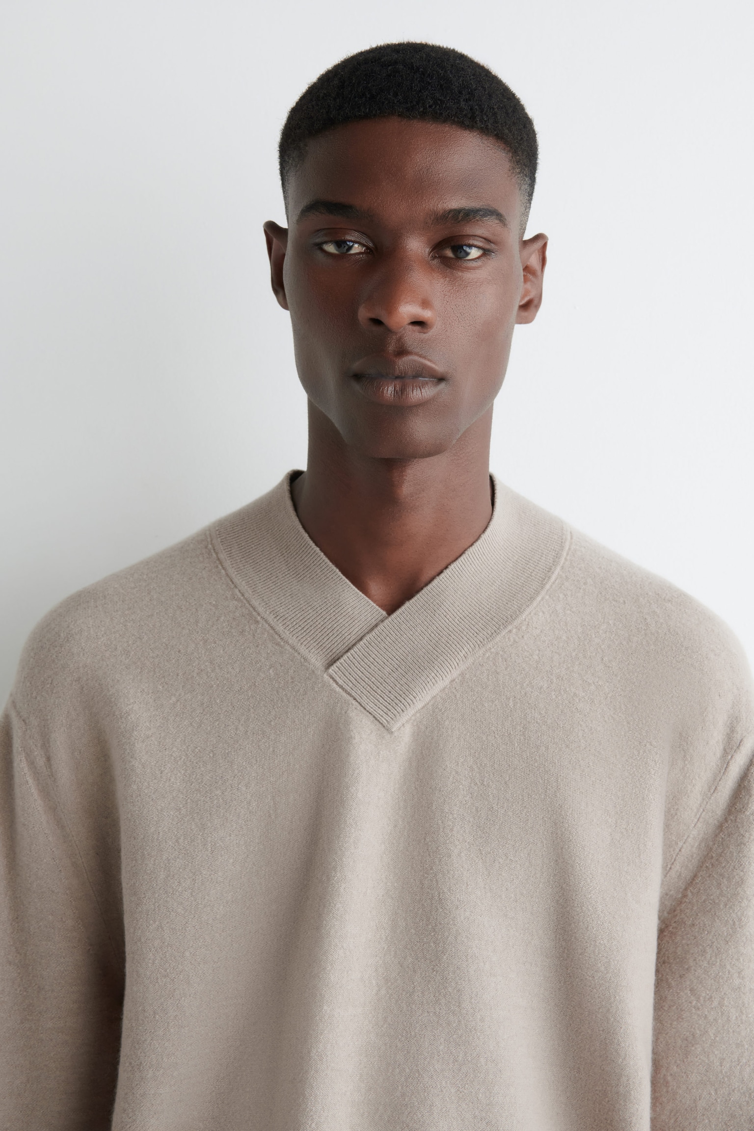 STRIPED BOILED-WOOL V-NECK JUMPER - BEIGE / STRIPED | COS GB