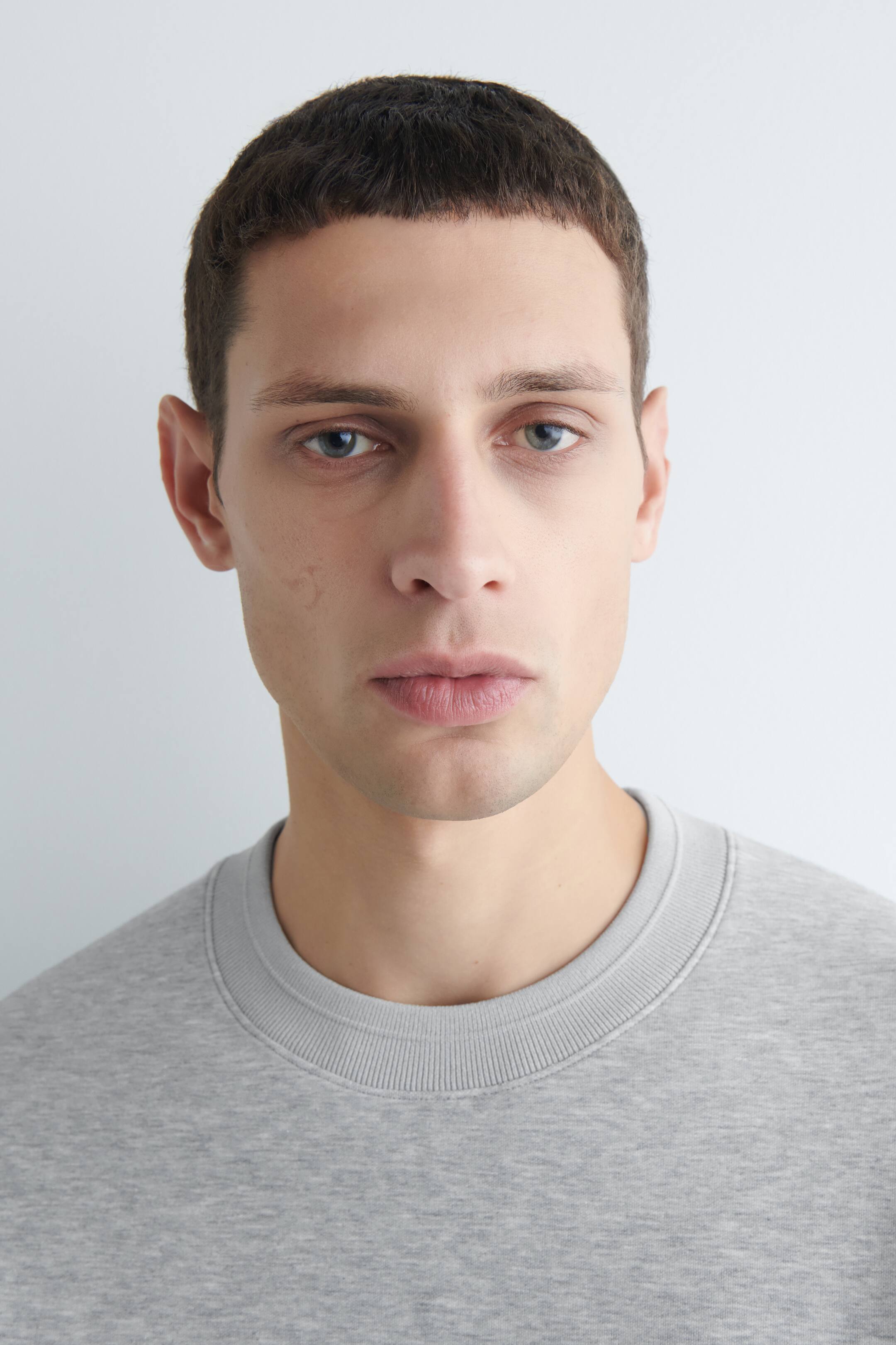 FELPA IN SCUBA DALLA VESTIBILITÀ RILASSATA - GRIGIO MÉLANGE - UOMO | H&M IT